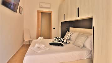 Apartamento Cidade, 2 quartos | 2 quartos, com mobília individualizada, ferro/tábua de engomar