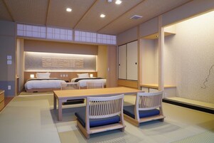 Quarto de Luxo, várias camas | Sala de estar