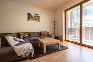 Apartamento superior | Área de estar | TV LCD, pebolim, pisos aquecidos