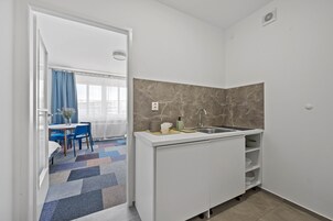 Estúdio, cozinha americana | Cozinha privada | Frigobar, chaleira elétrica