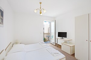 Quarto casal conforto, sacada, vista para o mar | Roupas de cama premium, camas Select Comfort, escrivaninha