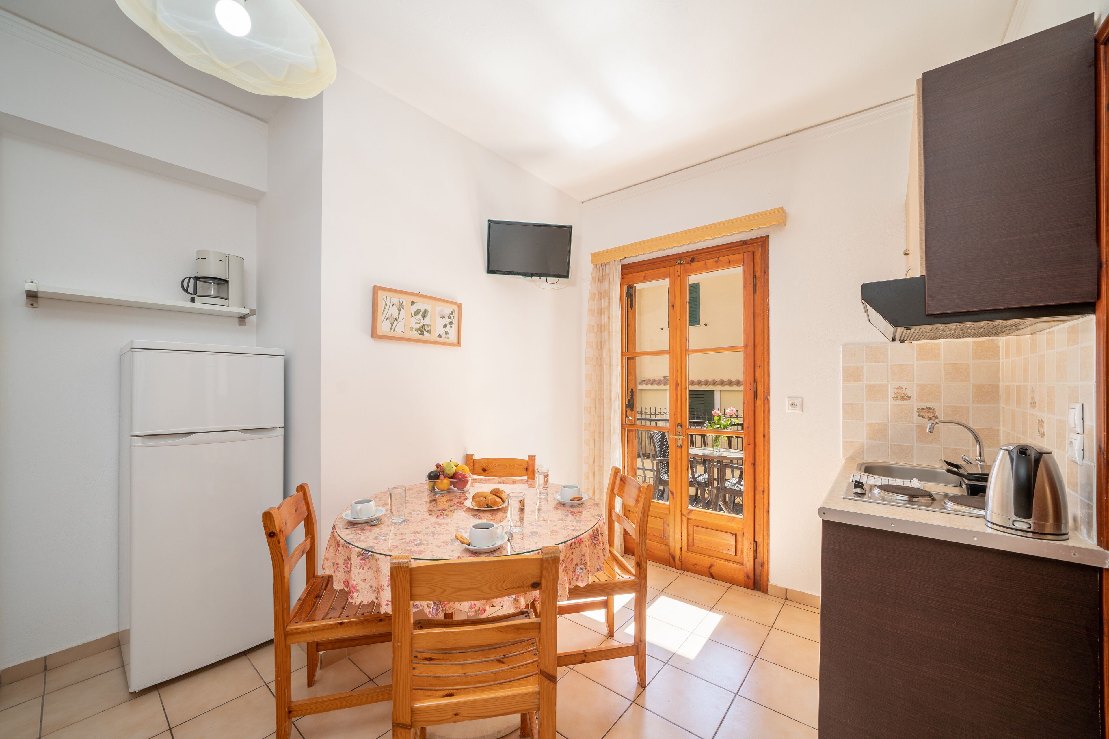 Apartamento standard | Cozinha privada | Geladeira, cooktop, cafeteira/chaleira, chaleira elétrica