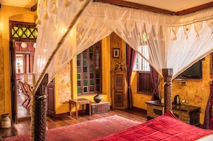 Suite Premier | Sala de estar | TV de ecrã plano