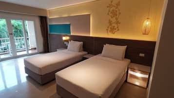 Quarto casal superior, 1 cama King | Frigobar, cofres nos quartos, cortinas blackout, Wi-Fi de cortesia