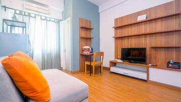 Quarto | Área de estar | TV