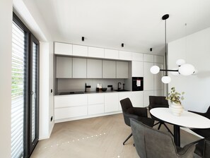 Apartamento superluxo, suíte | Cozinha compartilhada