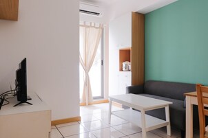 Quarto | Área de estar | TV