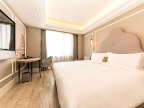 Quarto standard, 1 cama King | Frigobar, quartos à prova de som, Wi-Fi de cortesia