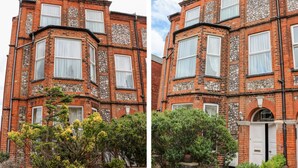 Um edifício de tijolos em estilo vitoriano, com várias janelas e detalhes em pedra.