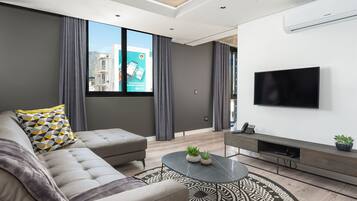 Apartamento conforto | Sala de estar | TV de tela plana