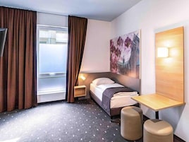 Quartos à prova de som, Wi-Fi de cortesia, roupa de cama