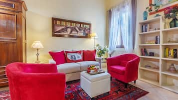 Apartamento, 1 quarto | Sala de estar | TV de ecrã plano