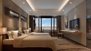 Quarto de hotel moderno com duas camas, uma mesa, uma TV e uma varanda com vista.