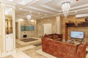 Apartamento Deluxe, 2 quartos | Sala de estar