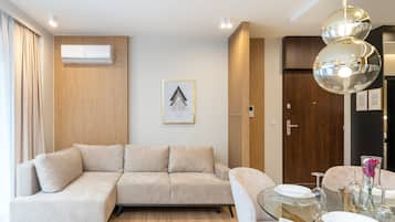 Apartamento Exclusivo | Sala de estar | TV de ecrã plano