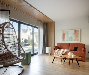 Apartamento, 1 quarto | Sala de estar | TV de ecrã plano 