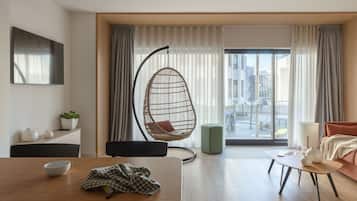 Apartamento, 1 quarto | Área de estar | TV de tela plana