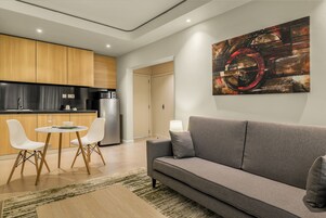 Apartamento luxo | Área de estar | TV de tela plana