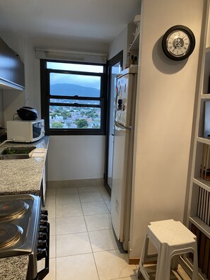 Apartamento exclusivo | Cozinha privada | Frigobar, micro-ondas, fogão, torradeira