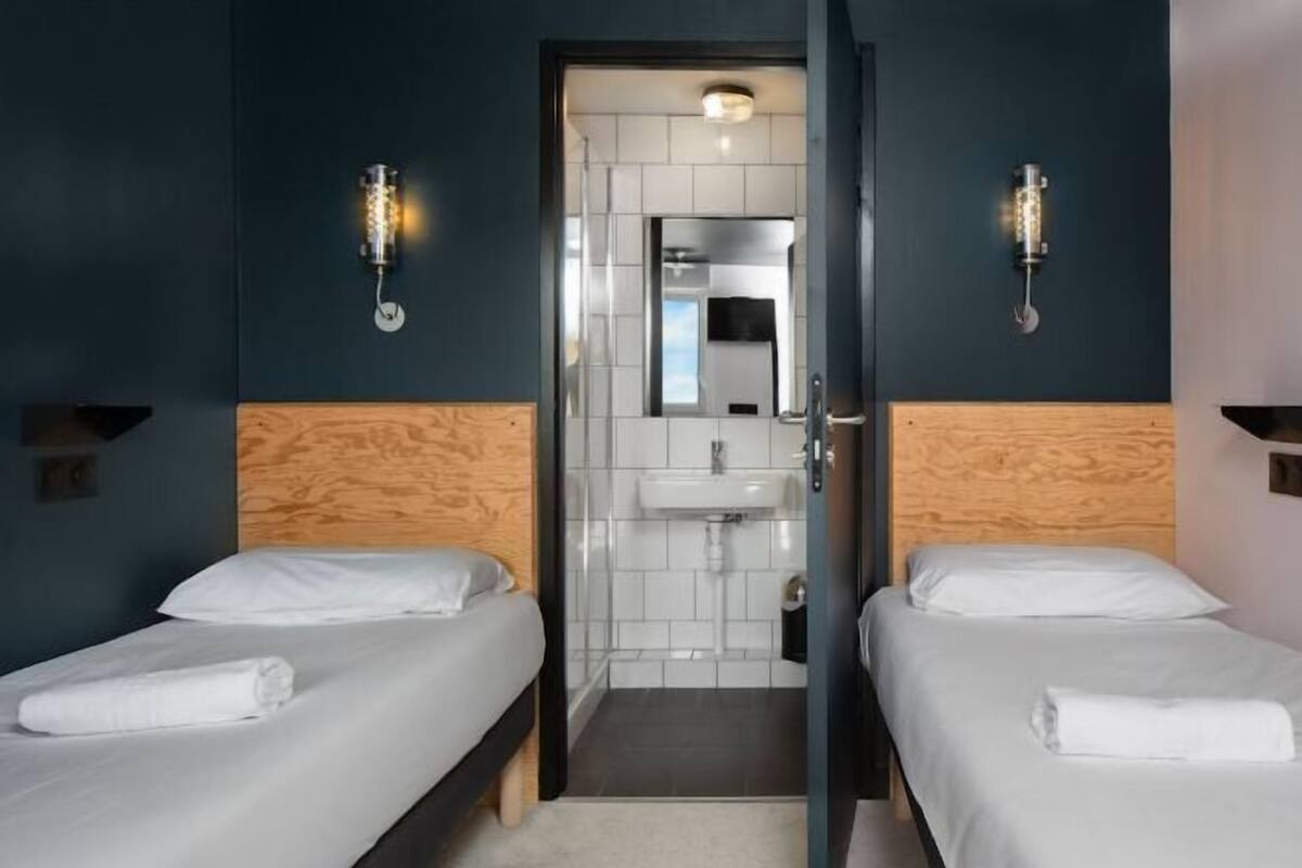 Roupas de cama premium, quartos à prova de som, Wi-Fi de cortesia