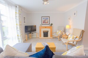 Apartamento, 1 cama de casal e sofá-cama, vista para o jardim, no piso térreo | Área de estar