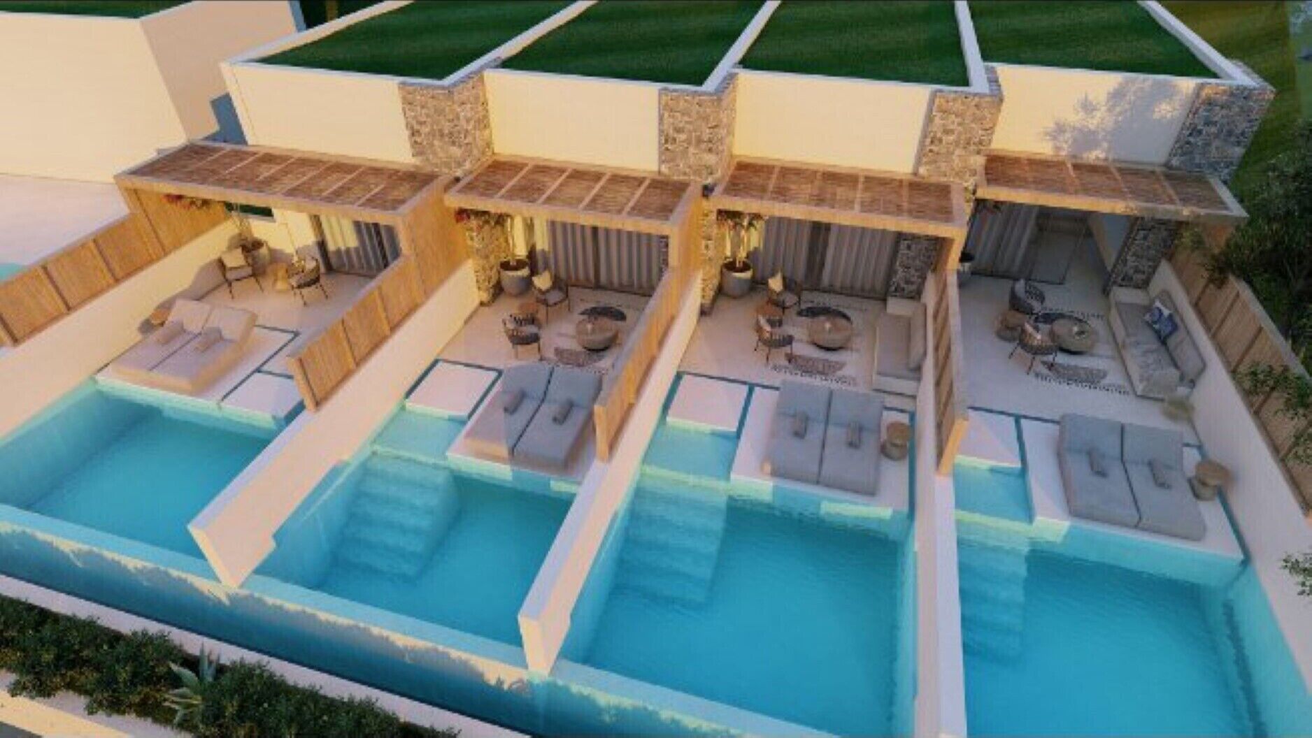 Uma área moderna de piscina ao ar livre, com várias áreas de descanso e um terraço coberto.