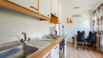 Apartamento | Cozinha privada | Uma placa de cozinha