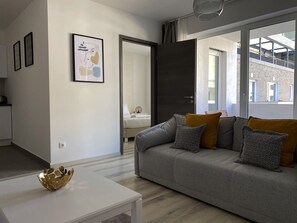 Apartamento, 2 quartos | Roupas de cama premium, edredons de pluma