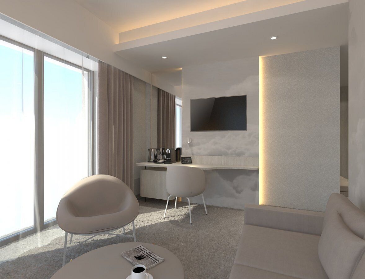 Quarto de hotel moderno com uma janela grande, televisão de tela plana na parede, mesa com cafeteira e duas cadeiras.