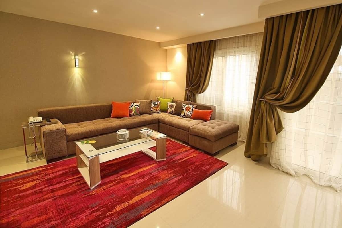 Apartamento luxo | Área de estar | TV de tela plana