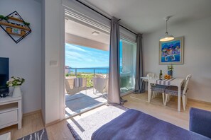 Apartamento superluxo | Área de estar | TV LED