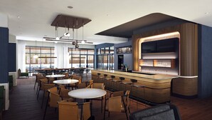 Um restaurante moderno com área de bar, mesas redondas e cadeiras.