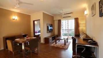 Suíte, 1 quarto | 1 quarto, roupas de cama premium, frigobar, cofres nos quartos