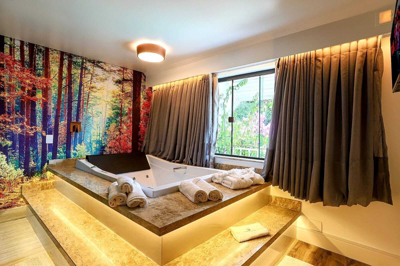 Quarto premium | Banheira de hidromassagem particular