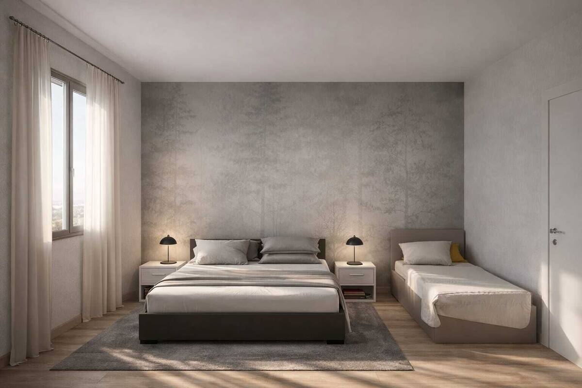 Quarto com cama grande, duas mesas de cabeceira com abajures, uma cama menor e um guarda-roupa.