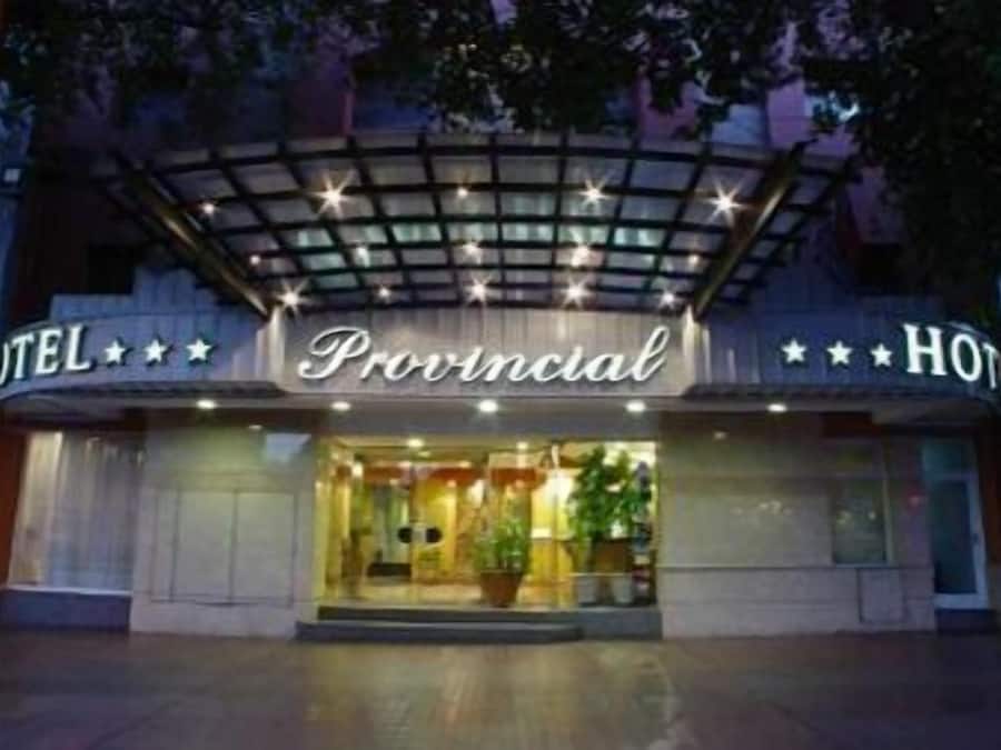 A hotel entrance with a marquee sign reading "Provincial Hotel" and a star rating of three stars.