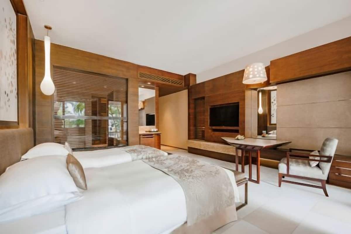Minibar, cofre no quarto, despertadores, acesso para cadeira de rodas