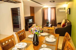 Suíte (Apartment) | Área de estar | TV de tela plana