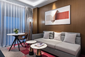 Quarto Deluxe, 1 cama king-size | Sala de estar