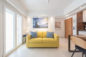 Apartamento urbano | Área de estar | TV de tela plana 42 polegadas com canais digitais, TV, escritórios