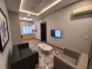 Suite Executiva | Sala de estar | Smart TV de 65 de polegadas com canais por cabo, televisor, Netflix