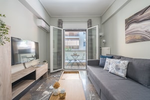 Apartamento Cidade | Sala de estar | TV de ecrã plano 