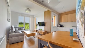 Apartamento (23 G) | Área de estar | TV de tela plana