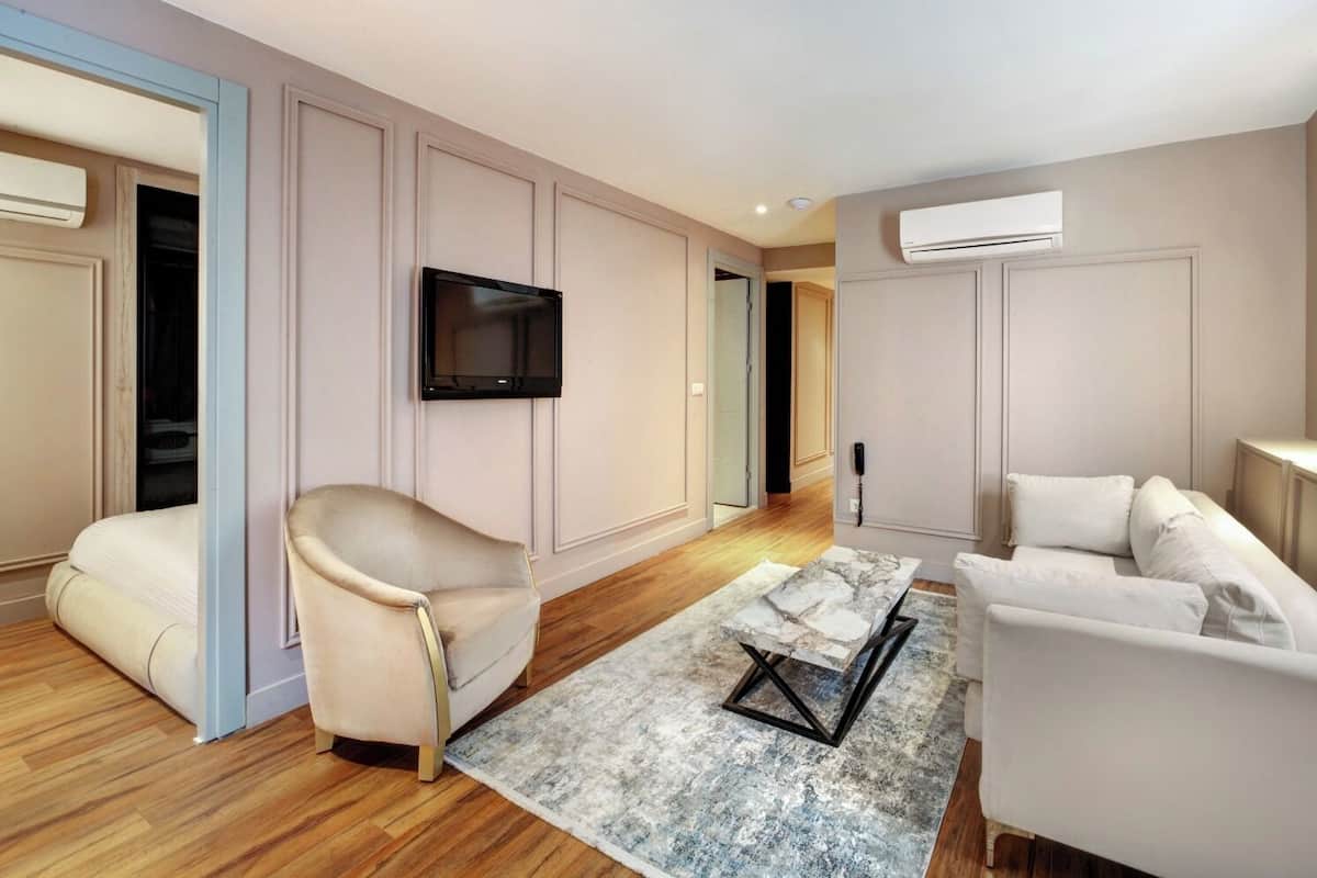 Suíte família, vista para a cidade | 2 quartos, roupas de cama premium, frigobar, cofres nos quartos