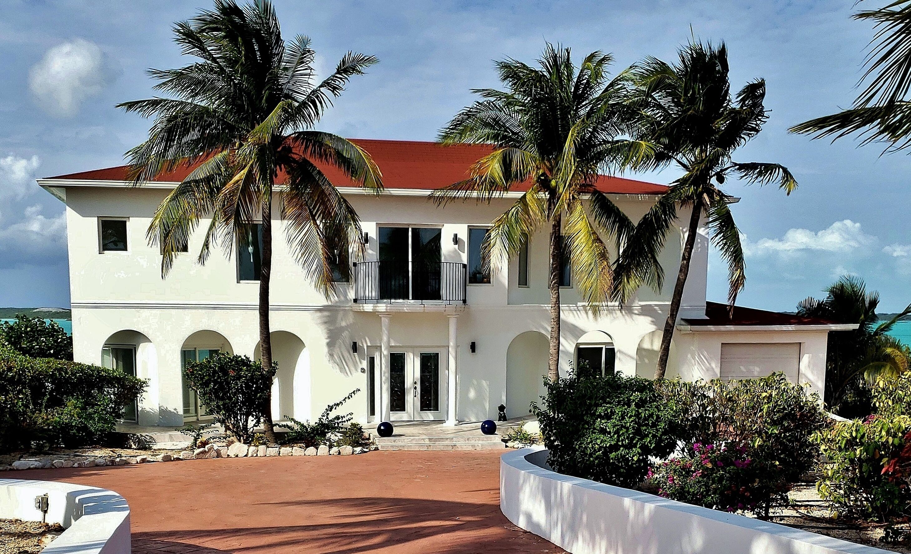 Beach and Silly Cay Inlet face the tranquil waters of the Caribbean Sea ...
