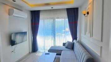 Apartamento exclusivo | Sala de estar | TV LED 40 polegadas com canais via satélite, TV
