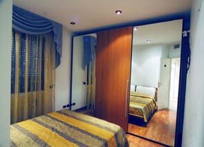 Apartamento, 2 quartos, fumadores, varanda | 2 quartos, ferro/tábua de engomar, Wi-fi