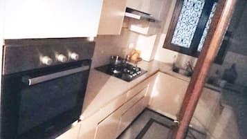 Apartamento | Cozinha privada | Geladeira, fogão, cooktop, lava-louças