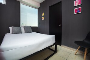 Quarto standard, sem janelas | Individualmente mobiliados, Wi-Fi de cortesia, roupa de cama