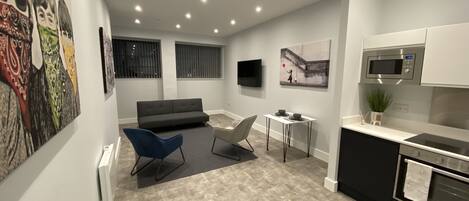 Apartamento luxo, acessível, suíte | Lounge